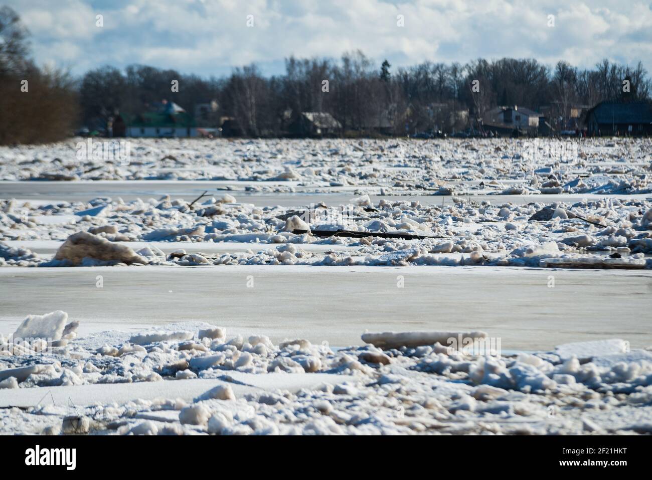 Spring floods. Sedimentation of ice blocks in a river that forms an ice ...