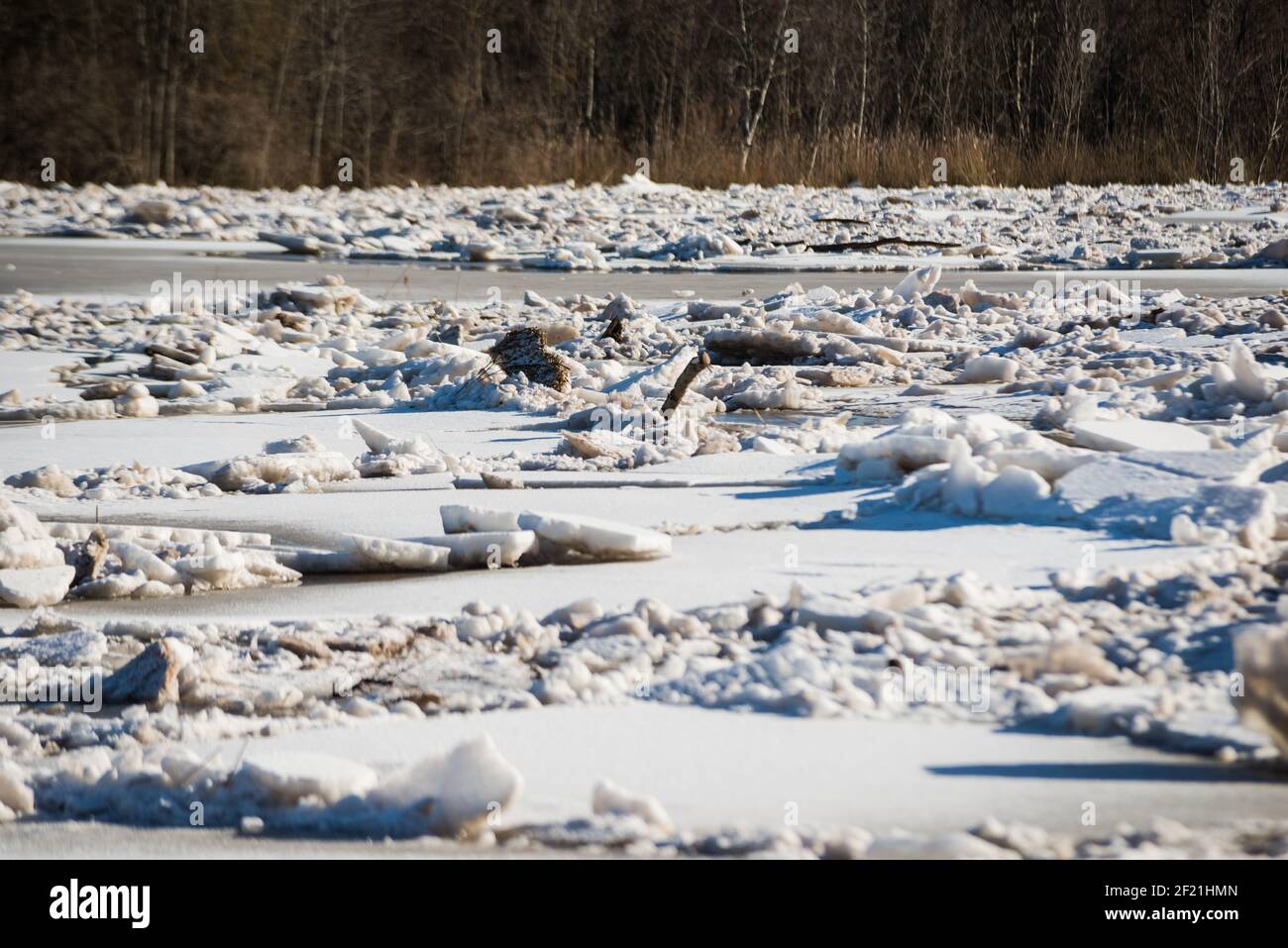 Spring floods. Sedimentation of ice blocks in a river that forms an ice ...