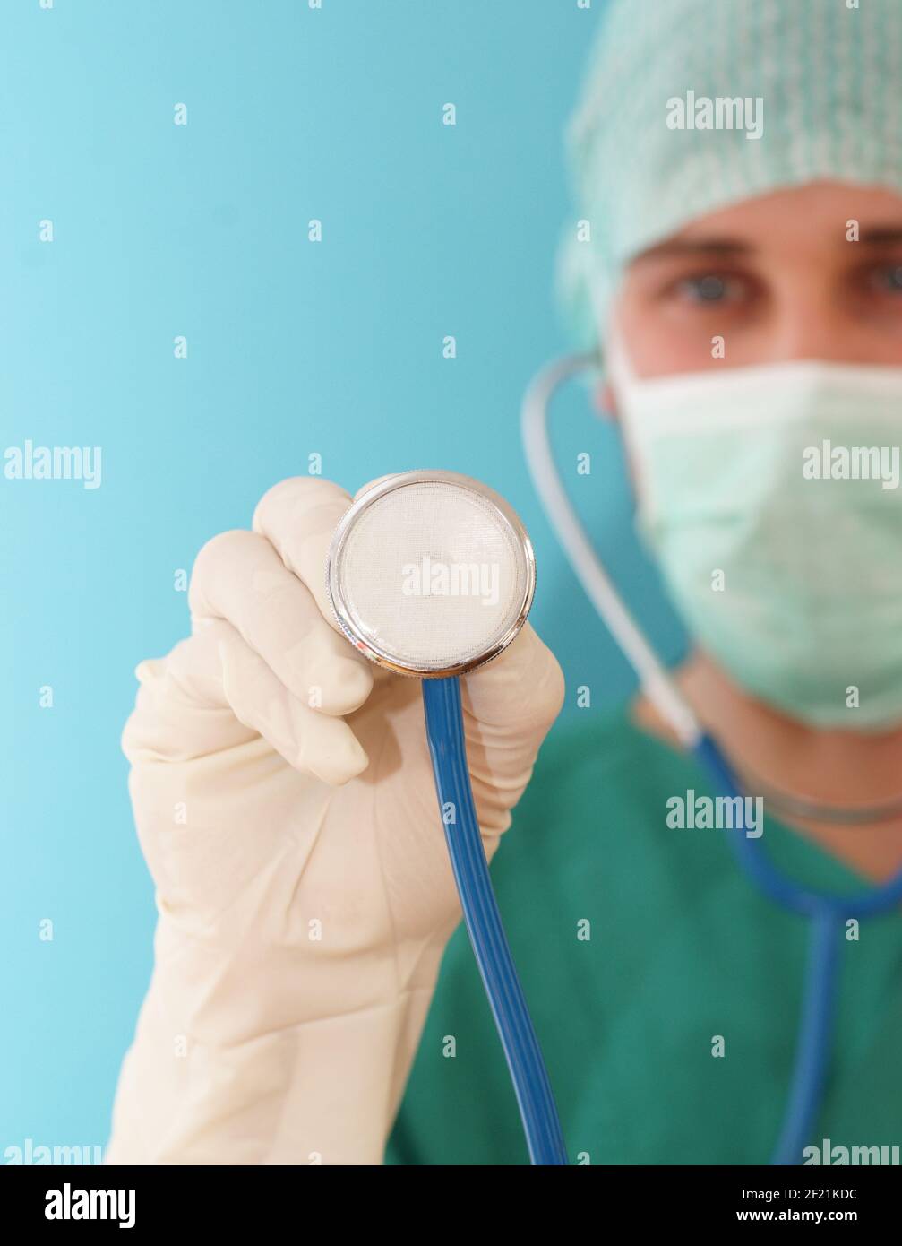 Young doctor surgeon orthopedist with breathing mask and hood after ...