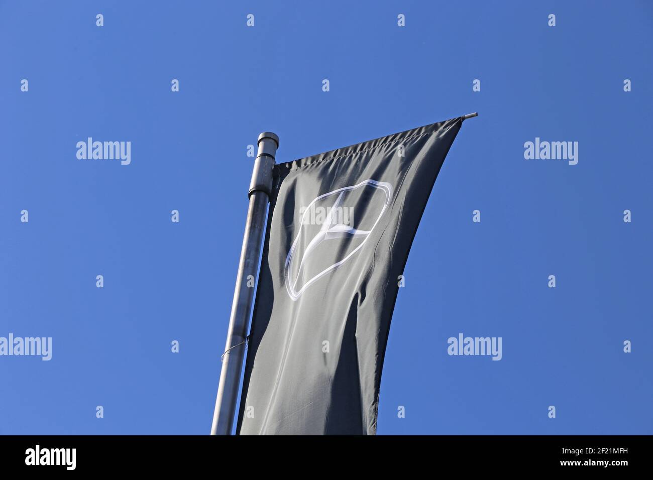 Flag with the Mercedes Benz star in front of a blue sky (Mannheim ...