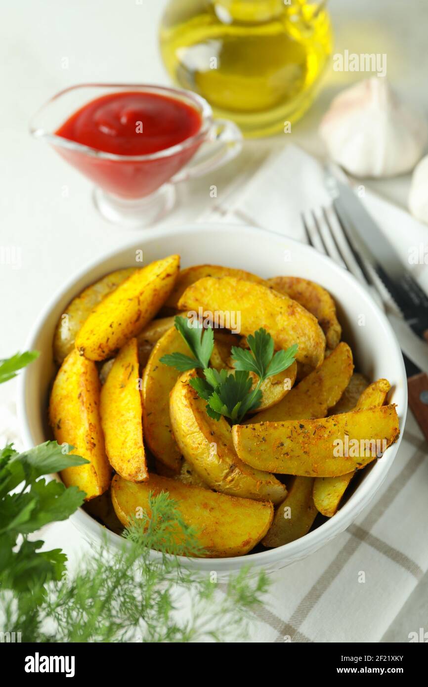 Concept of tasty meal with potato wedges, close up Stock Photo - Alamy