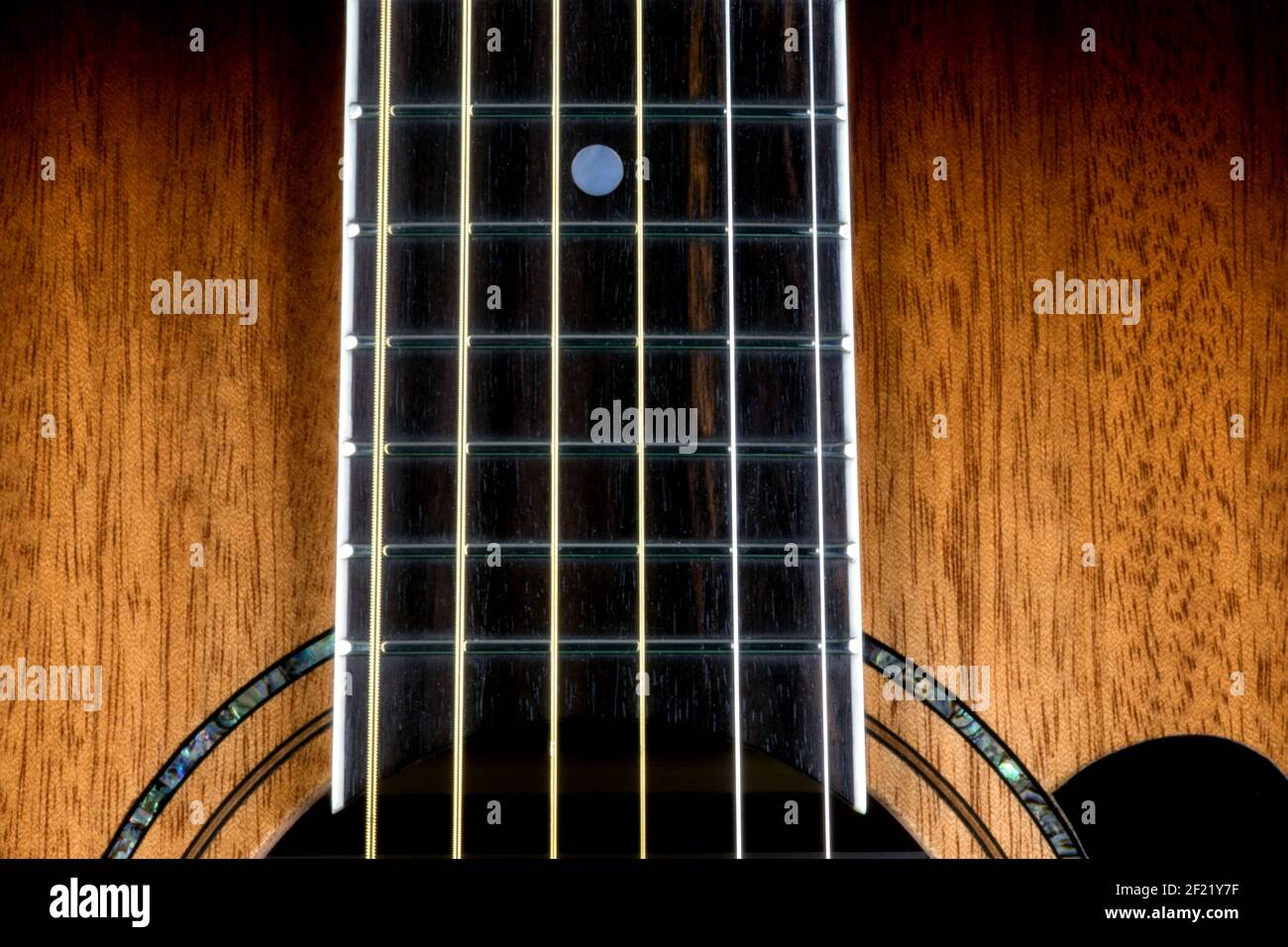 Mahogany acoustic guitar closeup view of body and fretboard Stock Photo ...