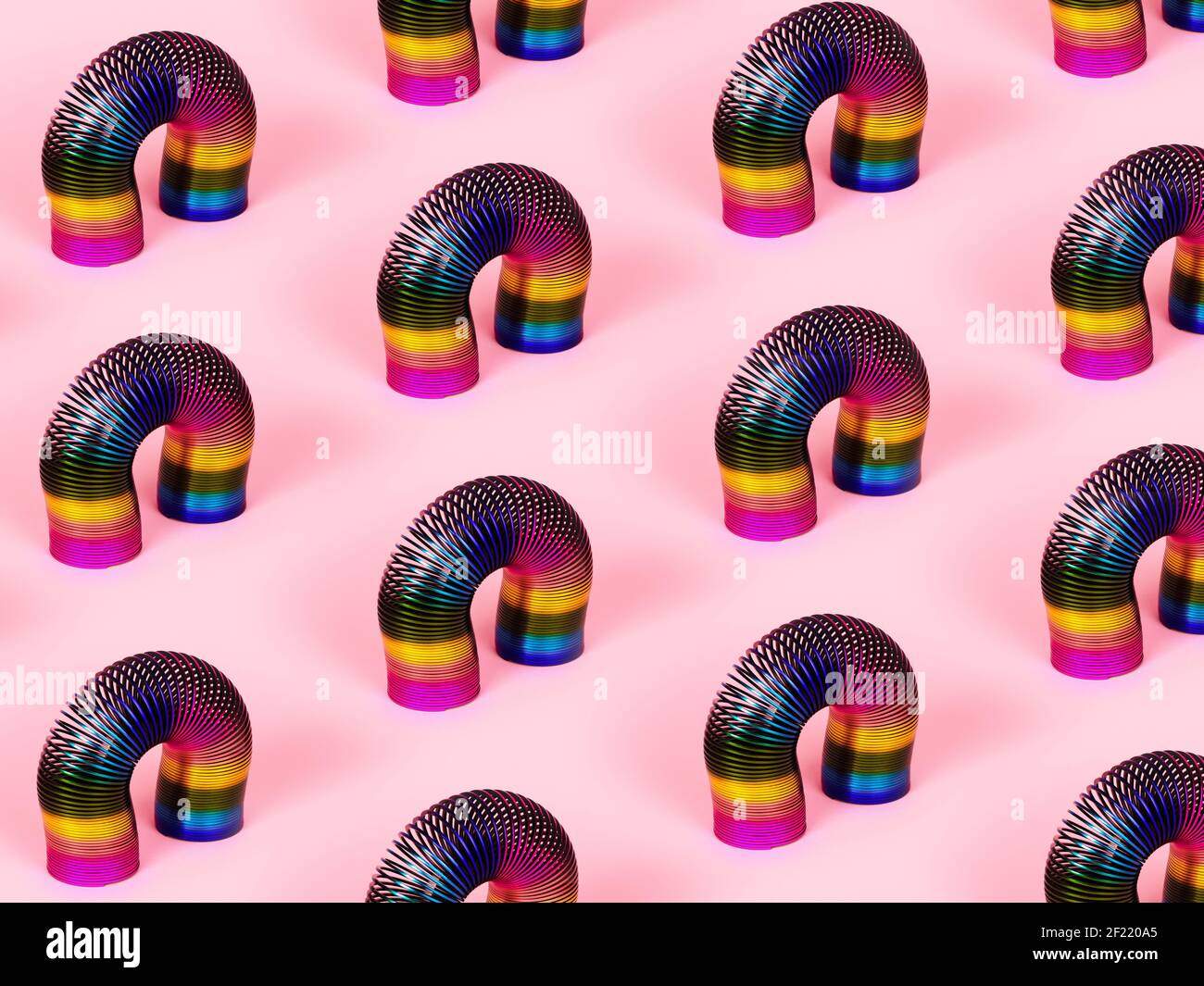 Colorful retro toys, slinky pattern over pink background Stock Photo ...