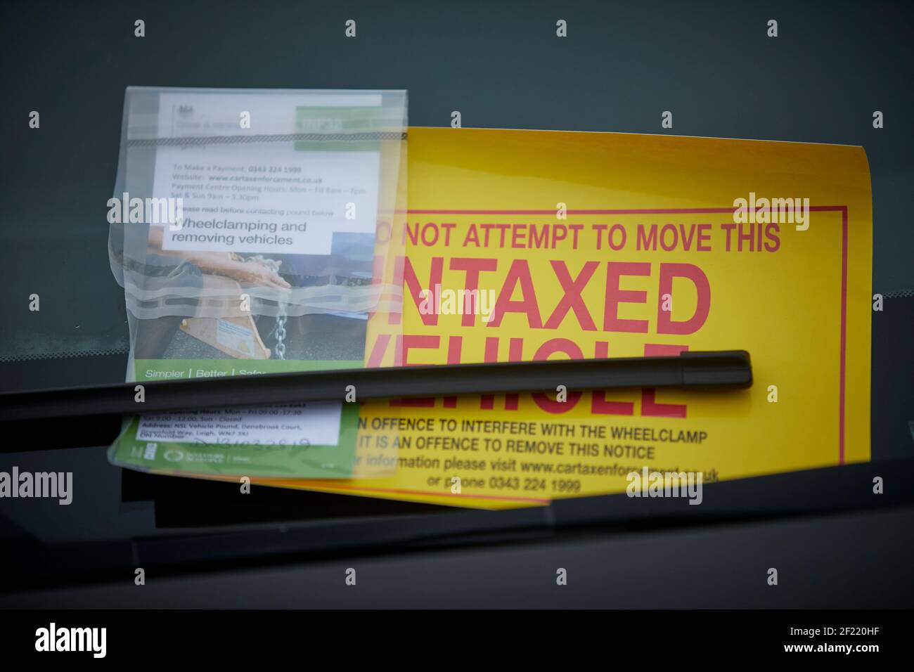 DVLA clamp an un taxed car on the highway in Preston Stock Photo - Alamy
