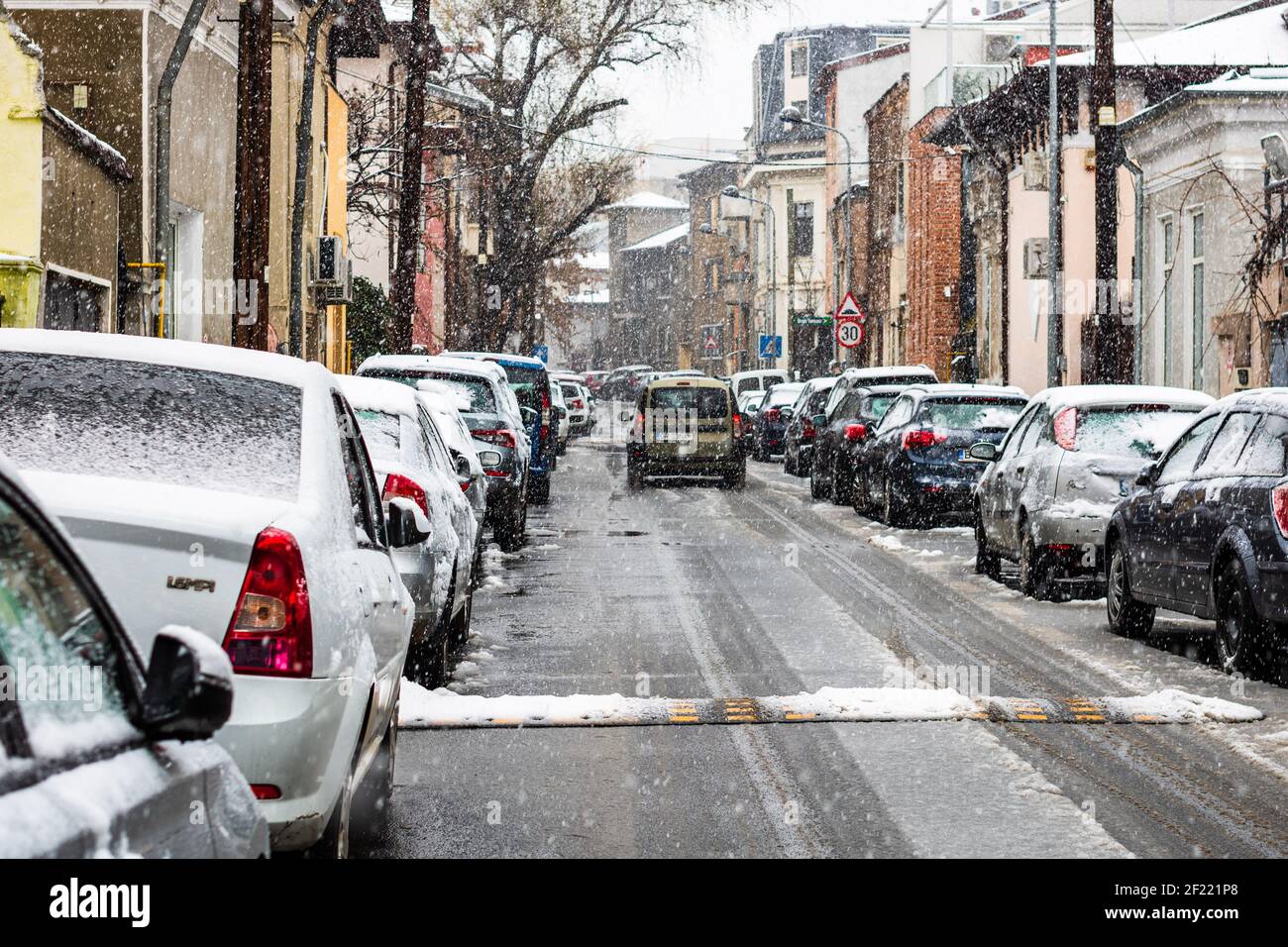 Snowing on cars in the morning, snow on street in Bucharest, Romania ...
