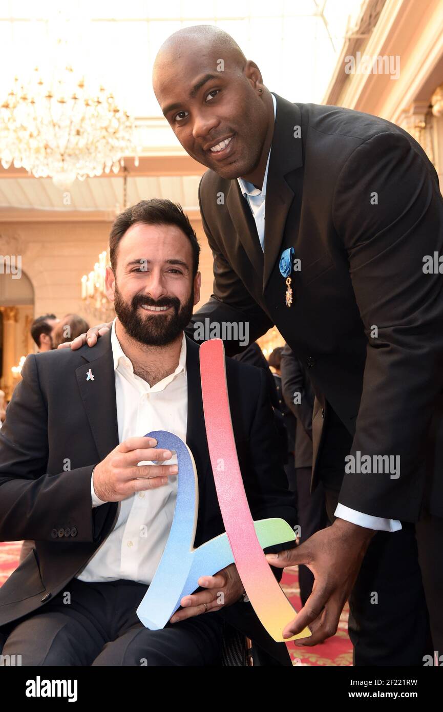 French olympic gold medalist Teddy Riner and Michael Jeremiasz pose ...