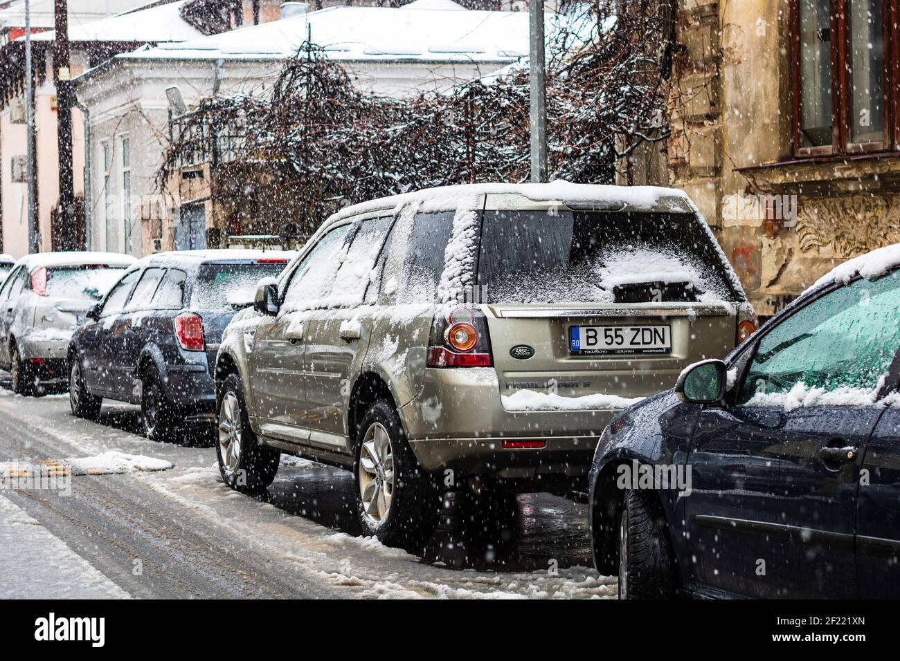 Snowing on cars in the morning, snow on street in Bucharest, Romania ...