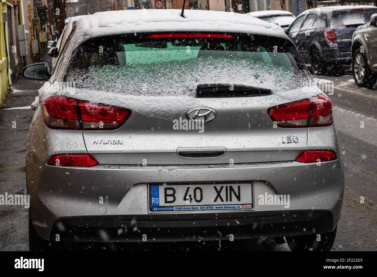Snowing on cars in the morning, snow on street in Bucharest, Romania ...