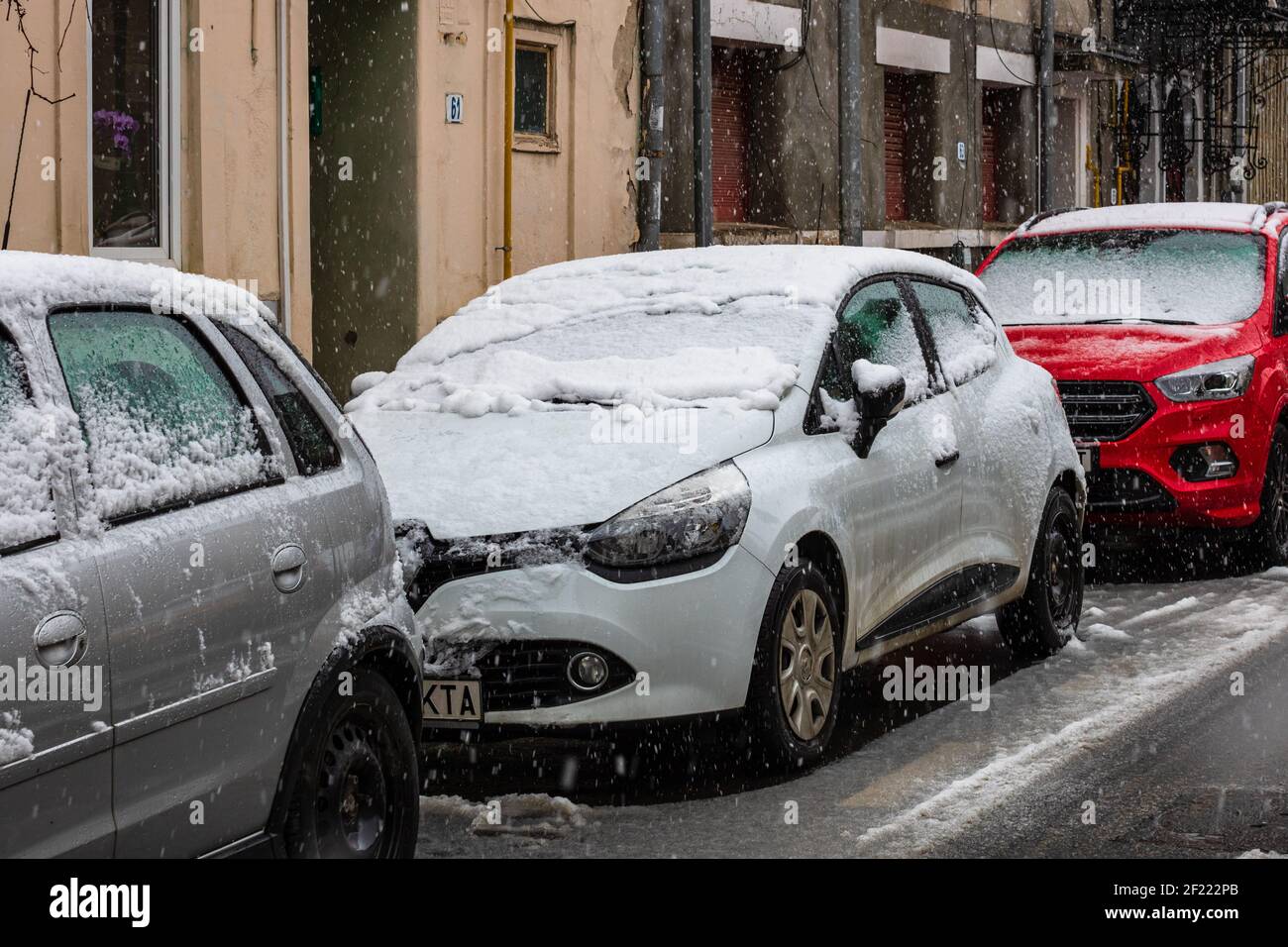 Snowing on cars in the morning, snow on street in Bucharest, Romania ...