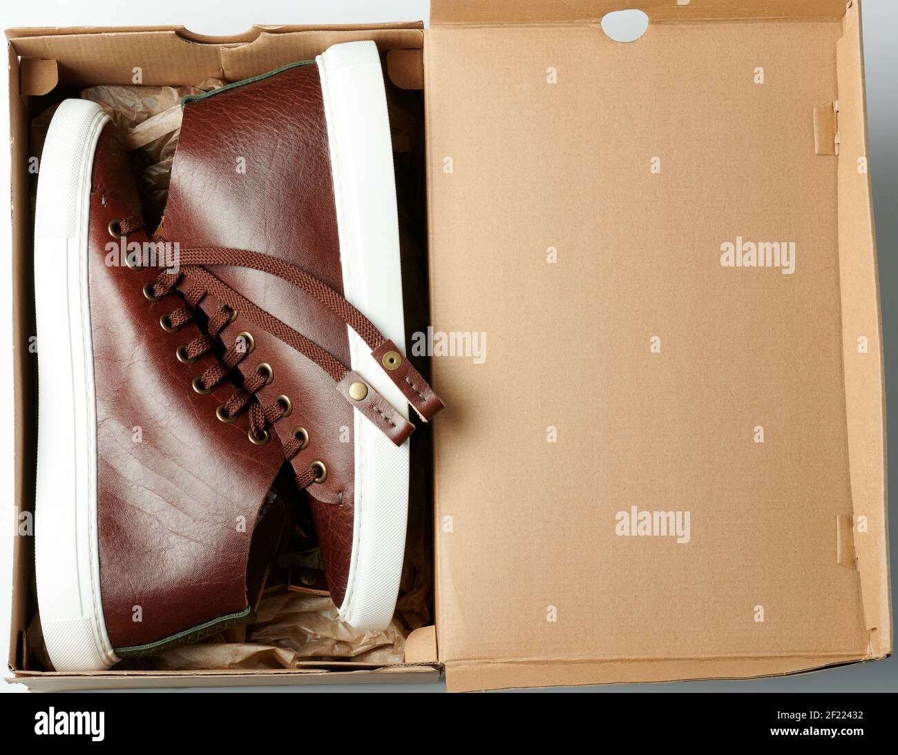 Brown leather shoes inside of box above top view isolated Stock Photo ...