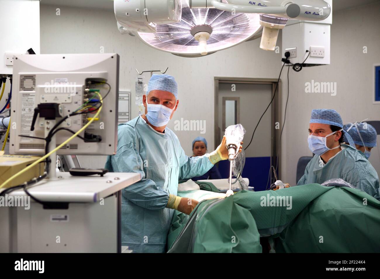 Dr. Chris Ogden with the Da Vinci surgical system Robot. The patient is ...