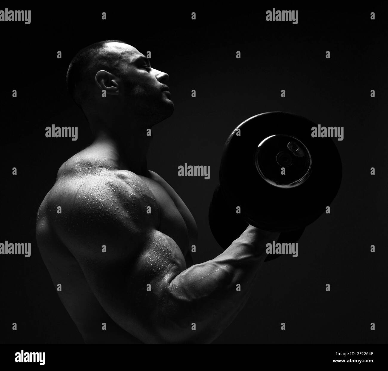 Calm and strong muscular men, bodybuilder is working out, lifting ...