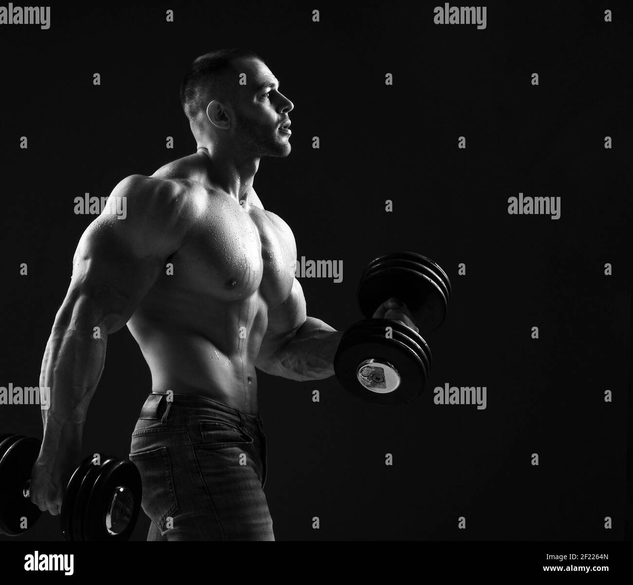 Two men lifting Black and White Stock Photos & Images - Alamy
