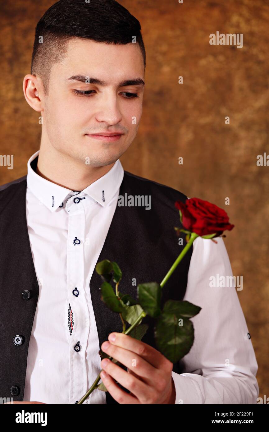 Man holding rose on black hi-res stock photography and images - Alamy