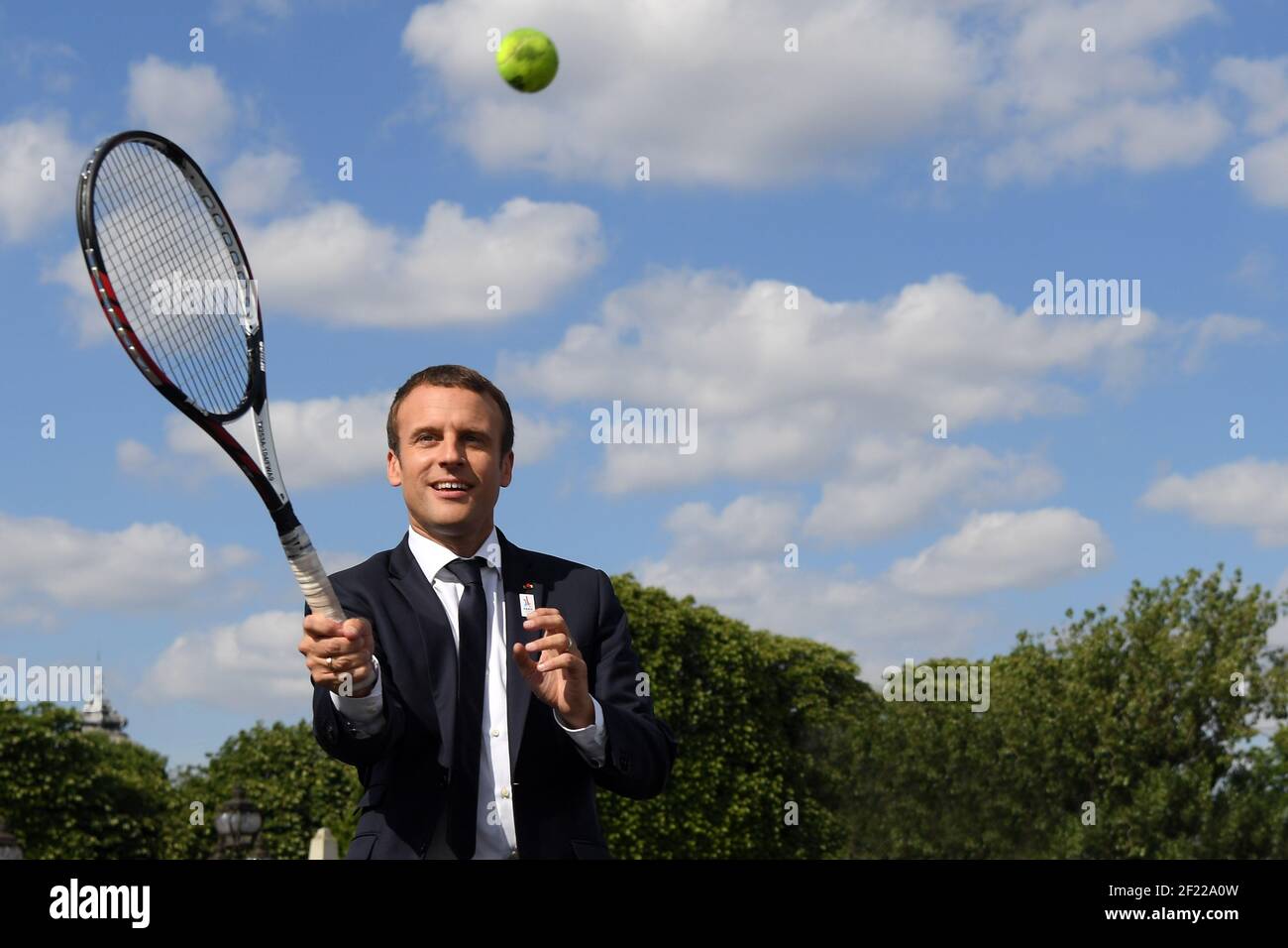 French Republic President Emmanuel Macron plays tennis during the ...