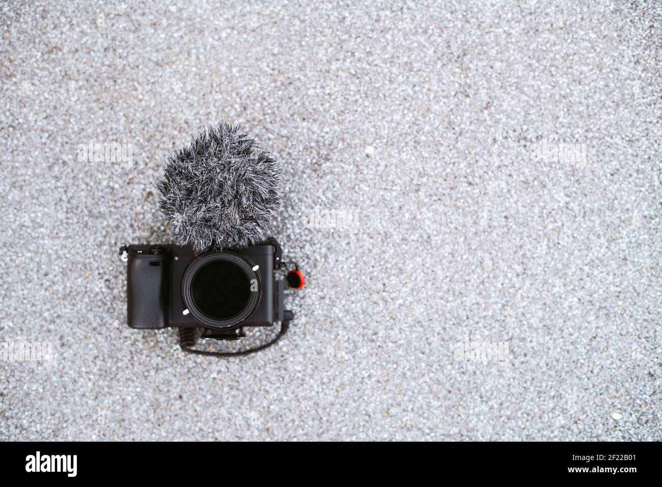 A camera with a microphone on grey background with copy space Stock ...