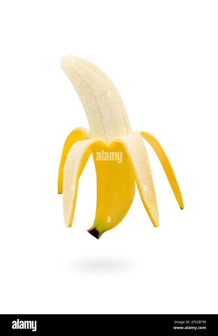 Single ripe organic cavendish banana peeled on white isolated ...