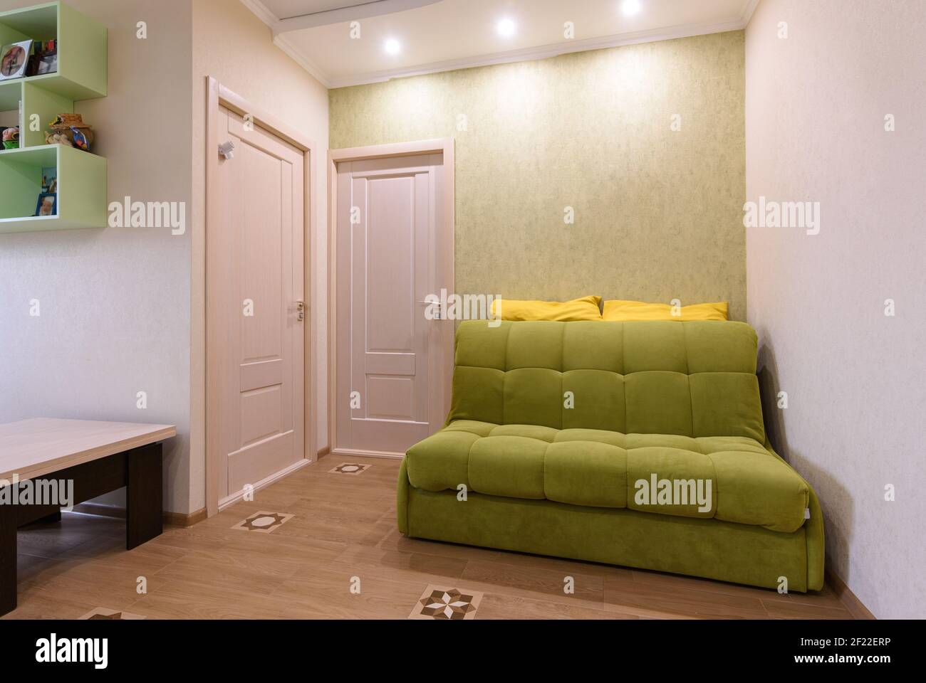 The interior of a walk-through living room in a two-room apartment ...