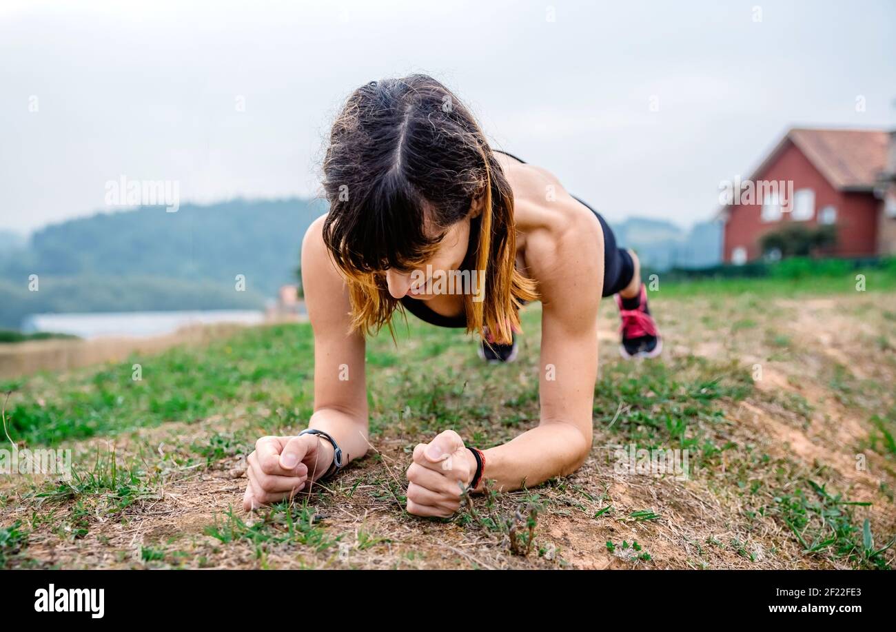 Female athlete training doing plank Stock Photo - Alamy