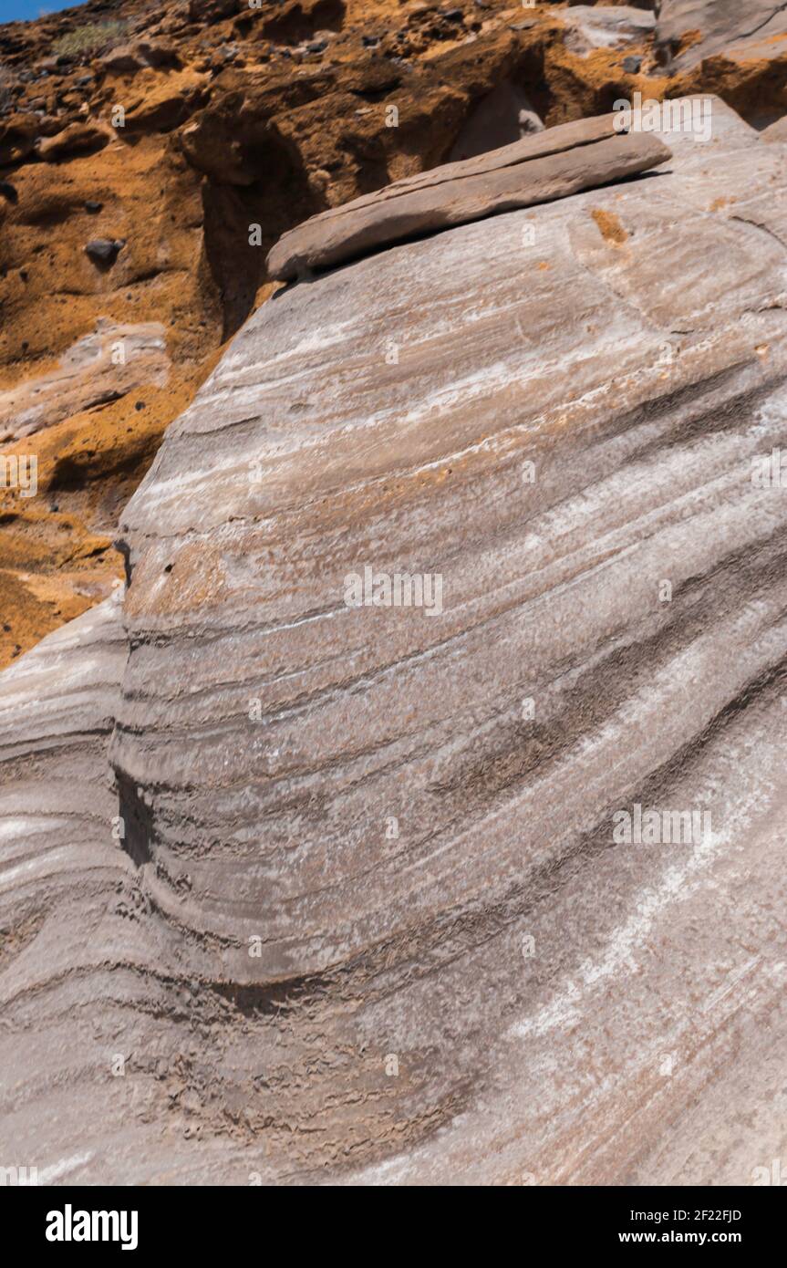 Washed out stone formation on a coast, the different sediments can be ...