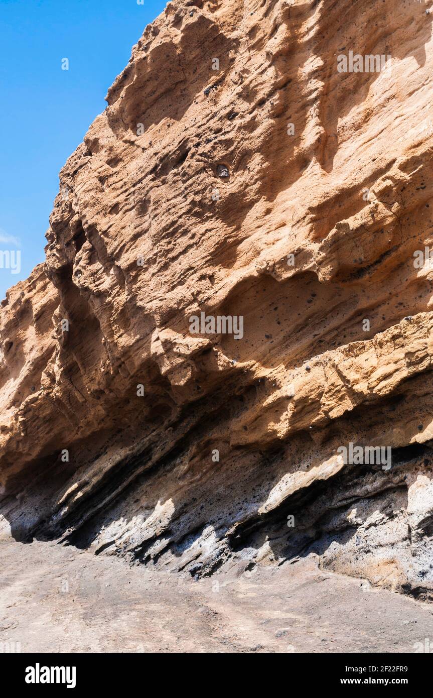 Washed out stone formation on a coast, the different sediments can be ...