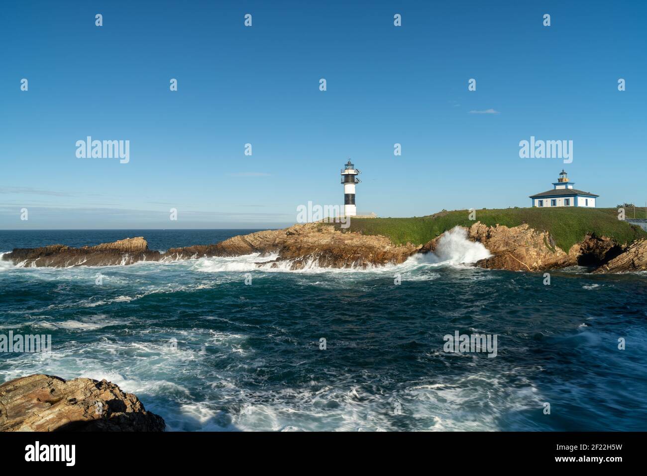 A view of the lighthouse on Isla Pancha in Galicia Stock Photo - Alamy
