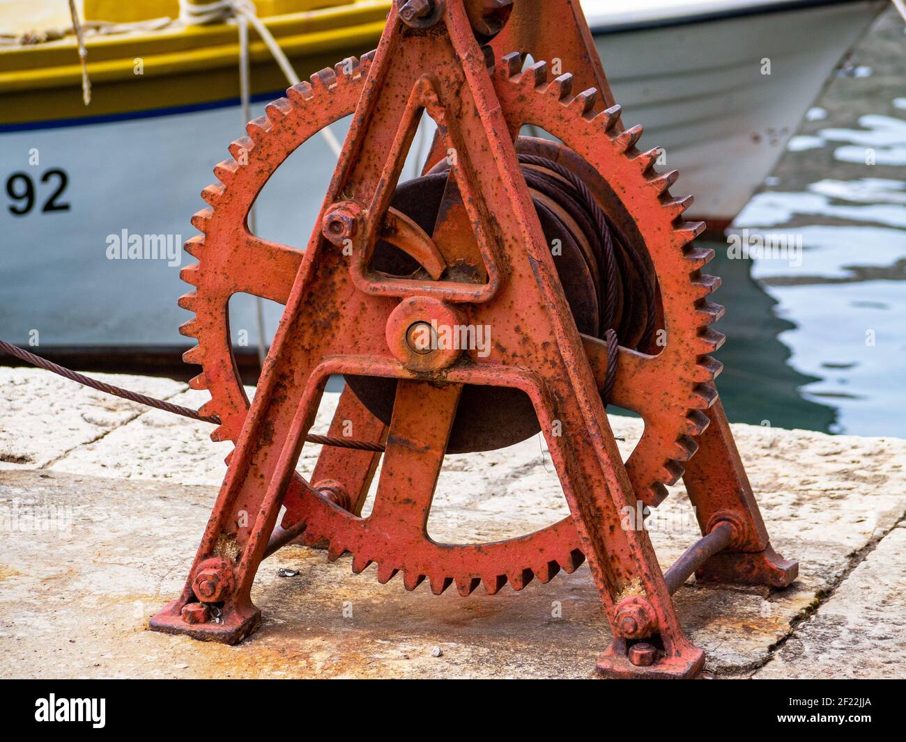 Rusty old boat winch with boat in the background Croatia Dubrovnik ...