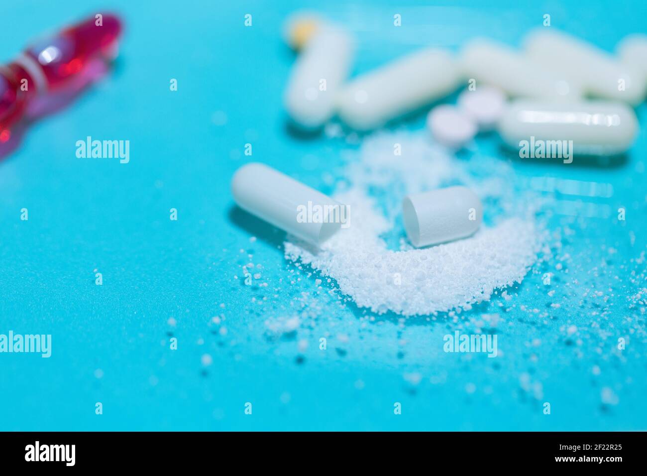 close up. open medicine capsule on a white background Stock Photo - Alamy
