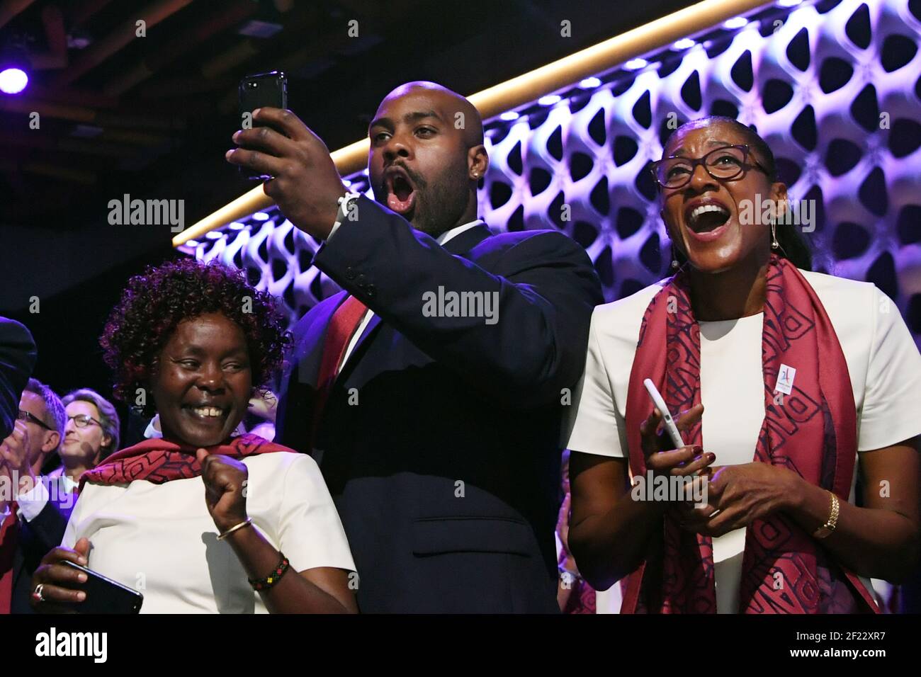 Teddy Riner and Marie-Jose Perec celebrate a victory during the Olympic ...