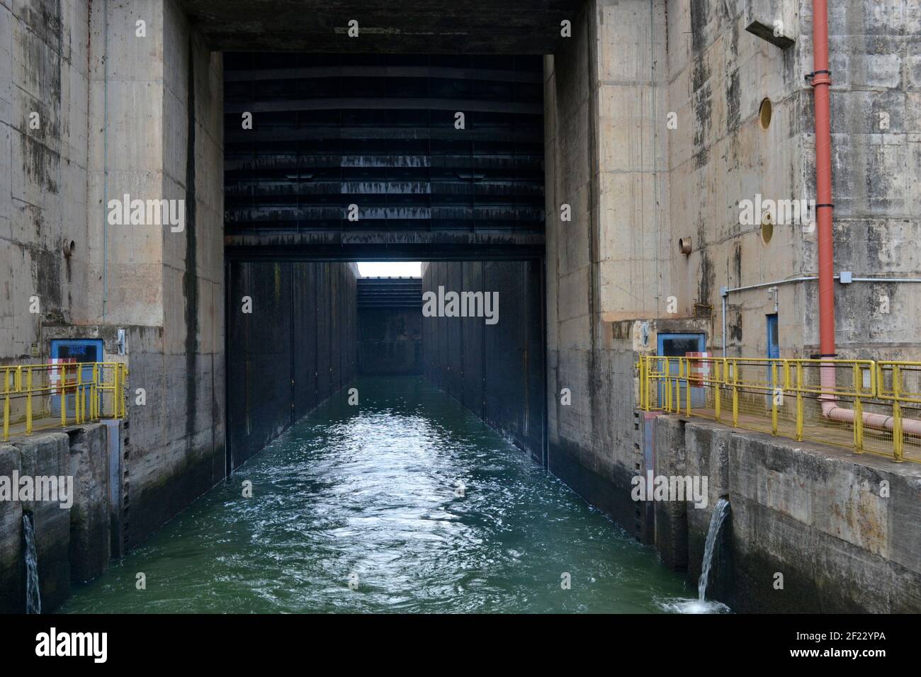 Dam. Very deep lock with tourist boat about to go up the dam in Brazil ...