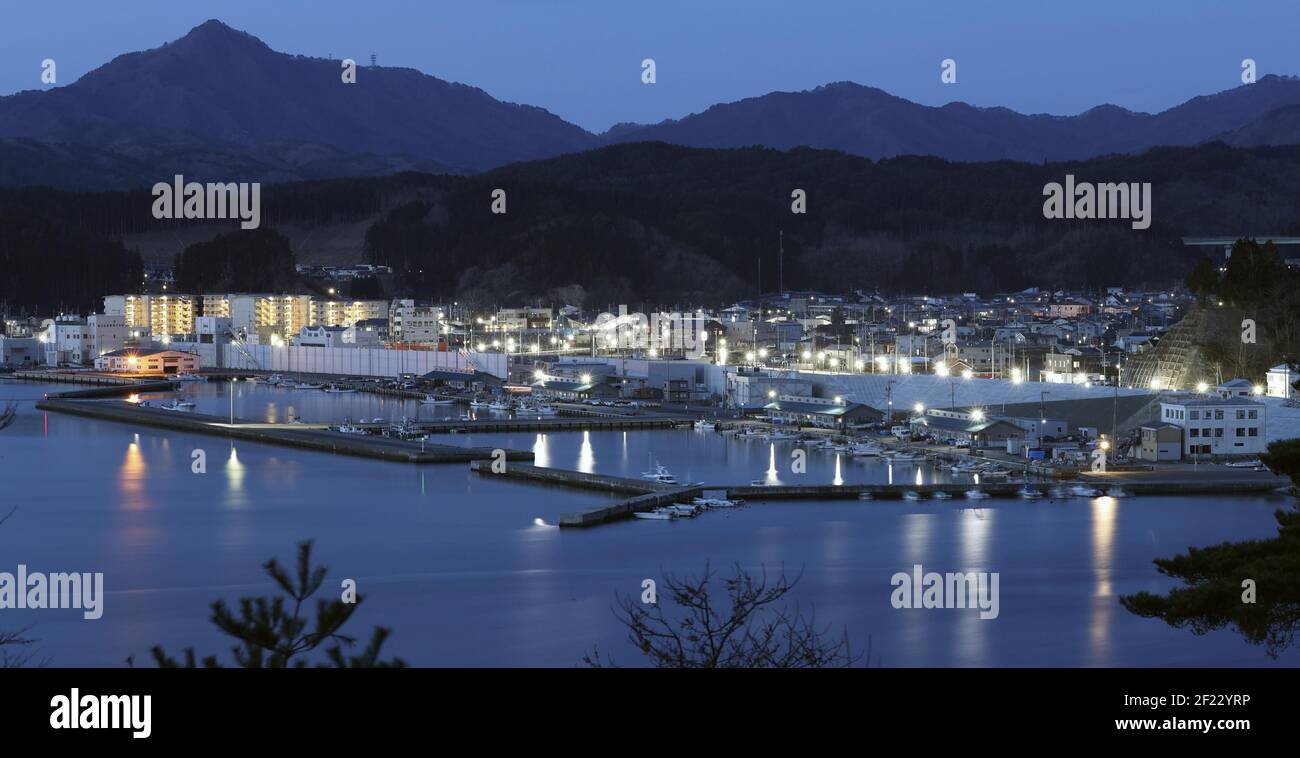 Photo taken before dawn on March 10, 2021, shows a fishing port in the ...