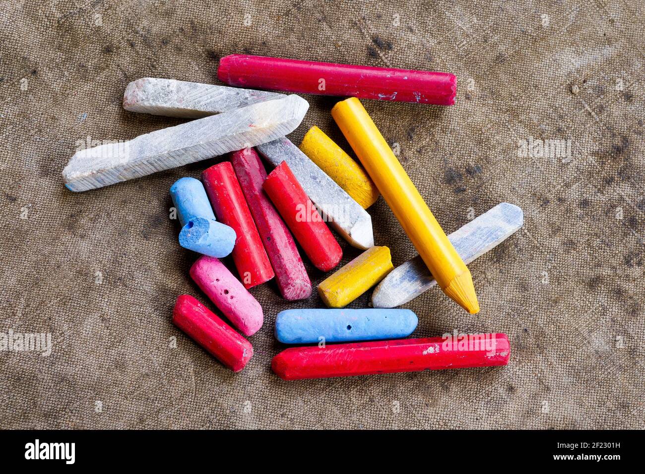 Old chalks displayed on a canvas background, France Stock Photo - Alamy
