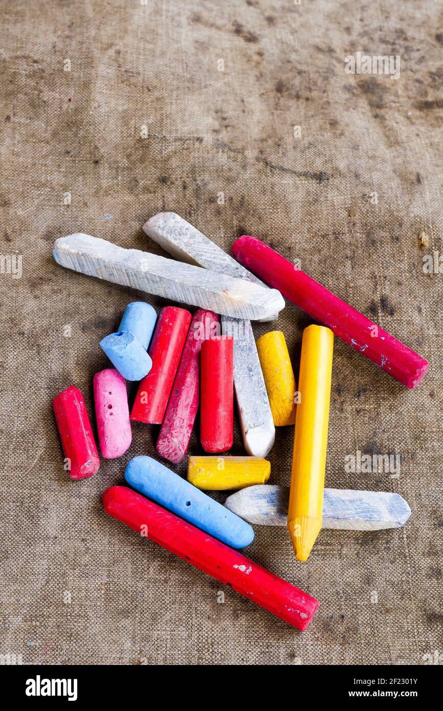 Old chalks displayed on a canvas background, France Stock Photo - Alamy