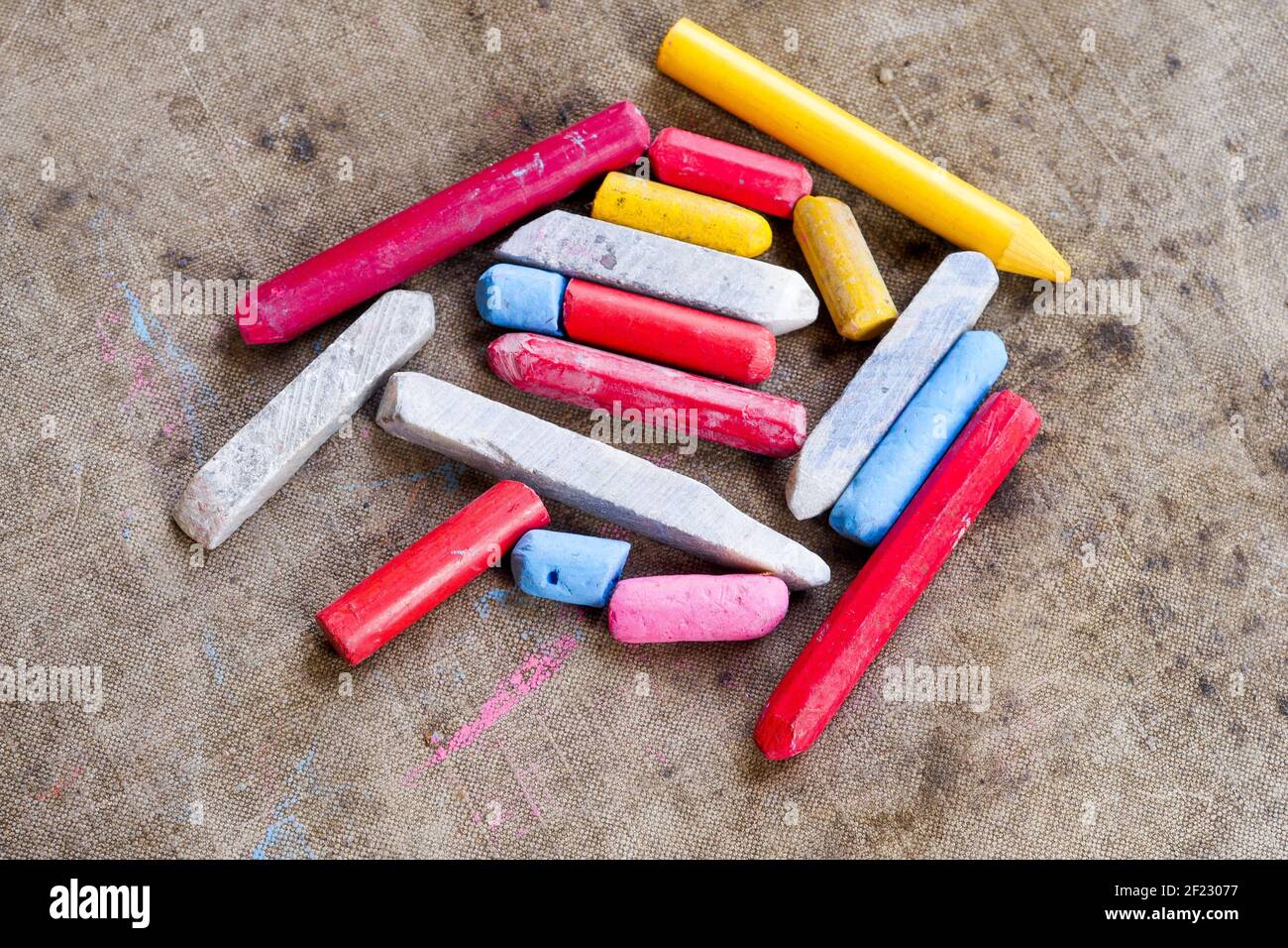 Old chalks displayed on a canvas background, France Stock Photo - Alamy