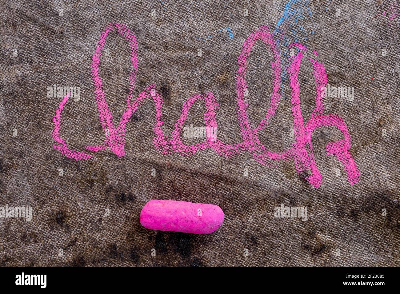 Pink chalk displayed on a canvas background, digitally filtered view ...
