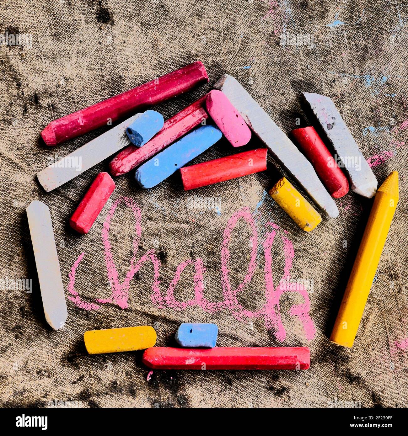 Old chalks displayed on a canvas background, digitally filtered view ...