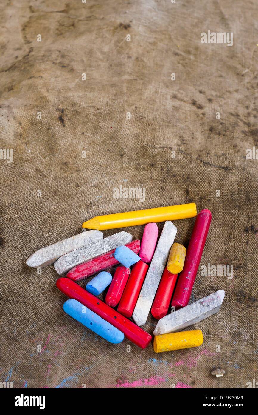 Old chalks displayed on a canvas background, France Stock Photo - Alamy