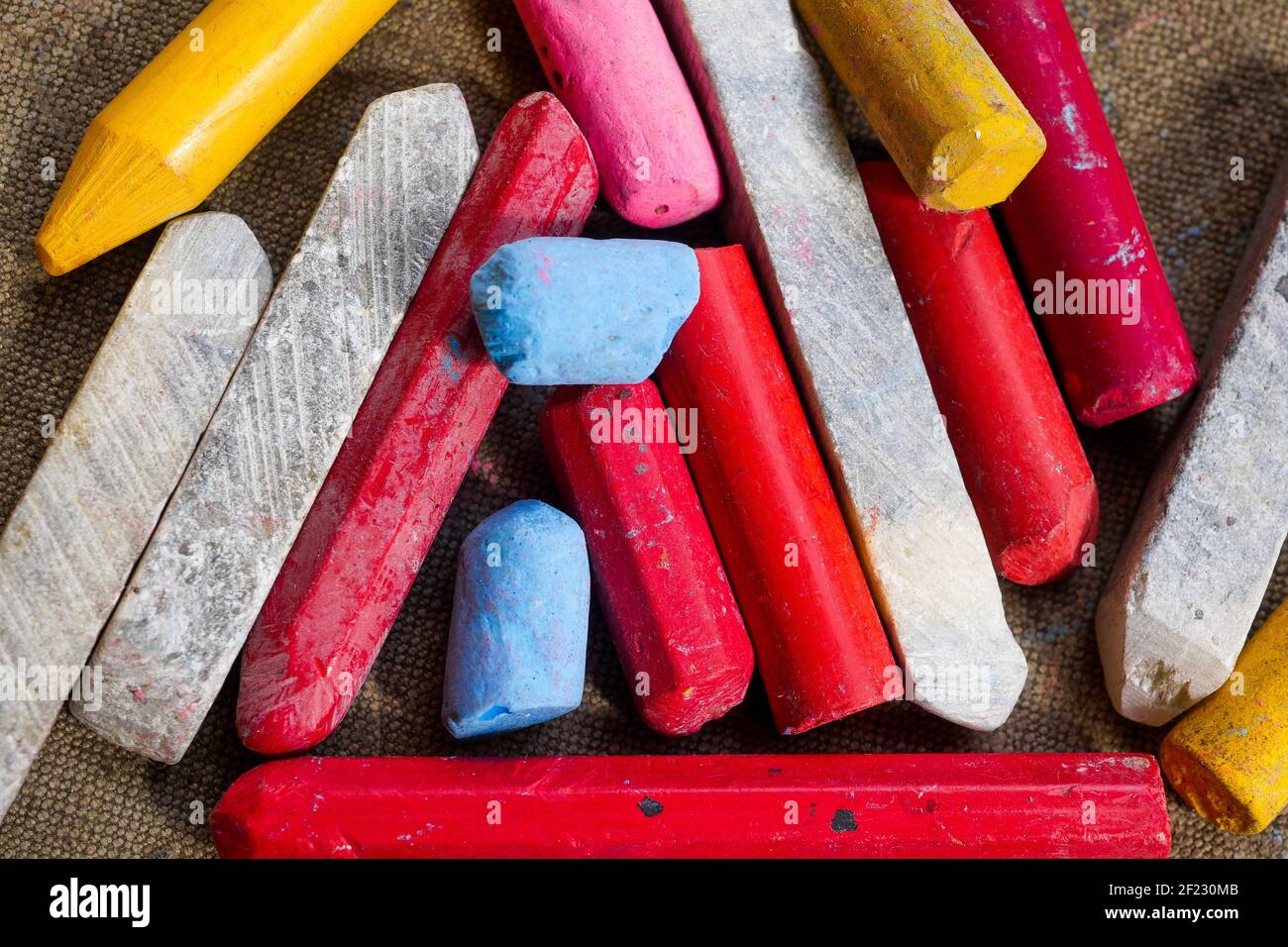 Old chalks displayed on a canvas background, France Stock Photo - Alamy