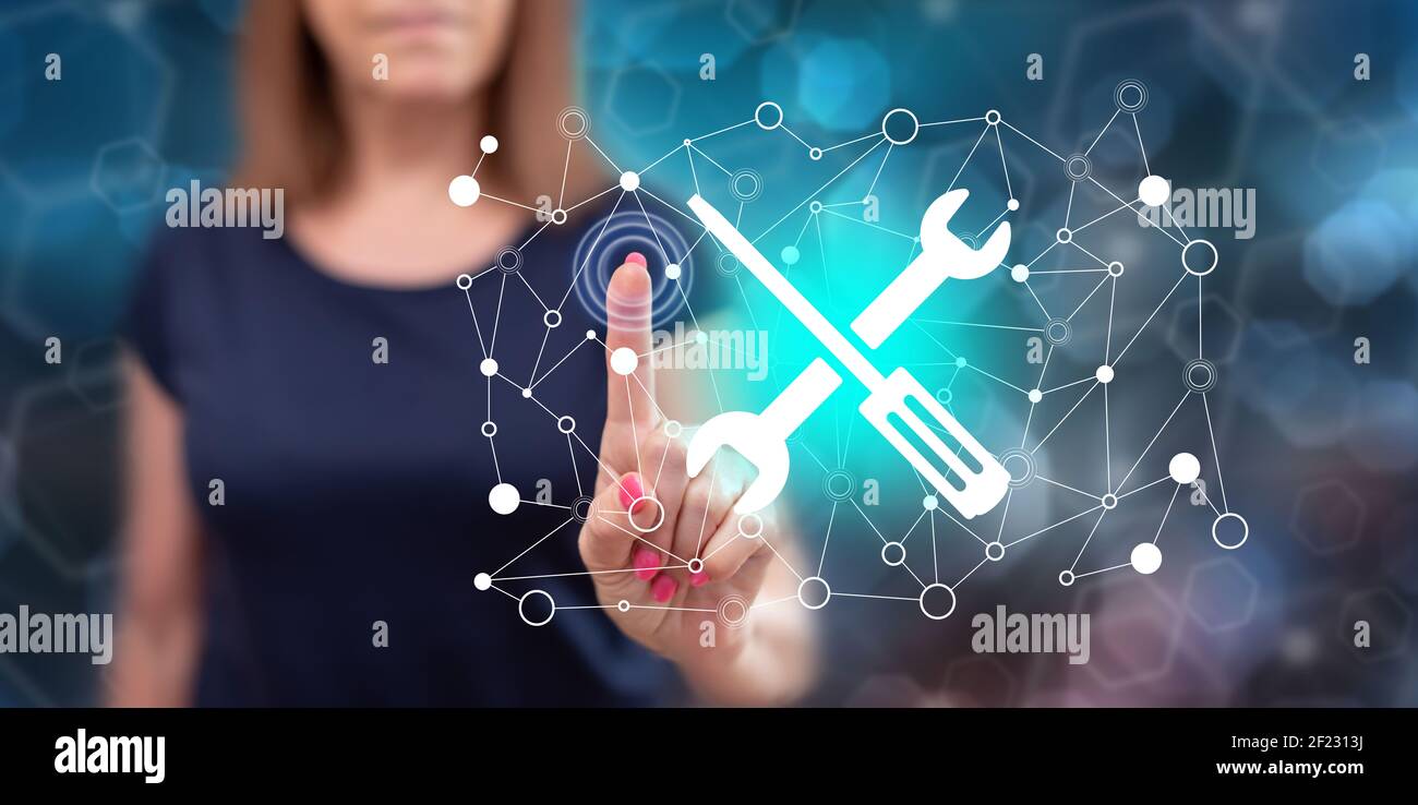 Woman touching a maintenance system concept on a touch screen with her ...