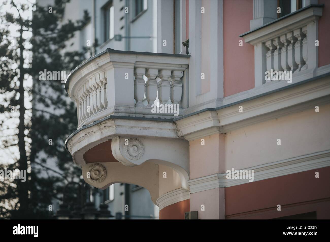 A balcony of an old building with white balusters Stock Photo - Alamy