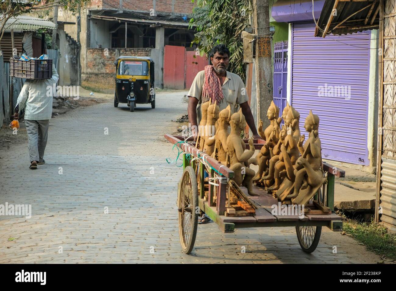 Lumding, India - January 2021: A potter craftsman transporting ...