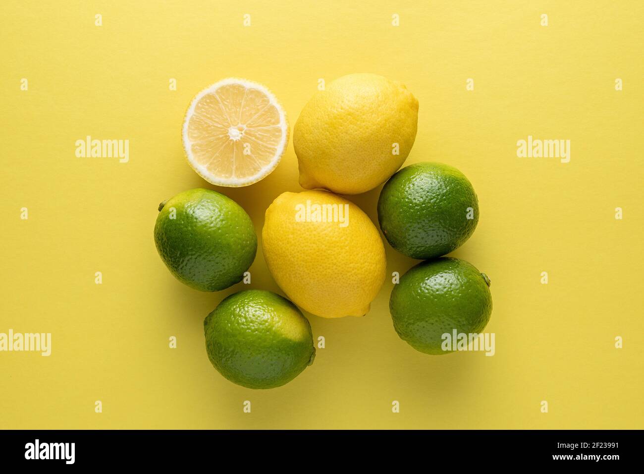 Lime and lemon on a bright background. Summer concept Stock Photo - Alamy