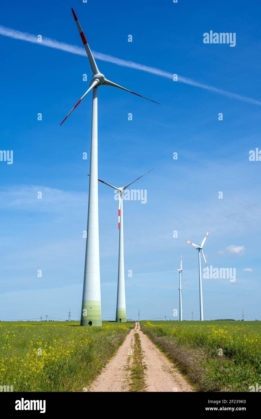 Modern wind energy generators and a country road seen in Germany Stock ...