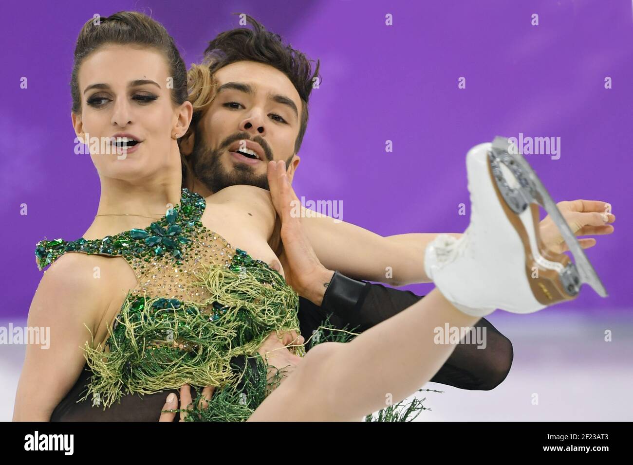 Gabriella Papadakis (Her dress is undone and reveals her bosom) and ...