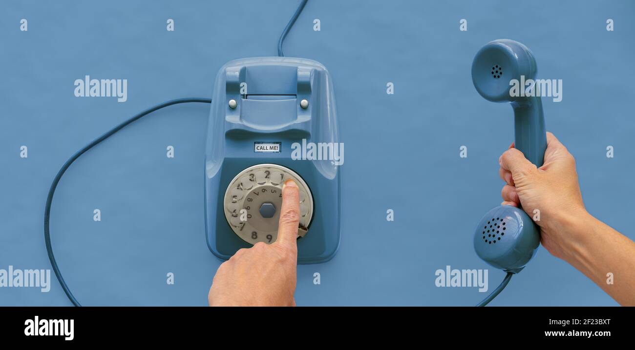 A vintage dial telephone handset with one hand and background Stock ...