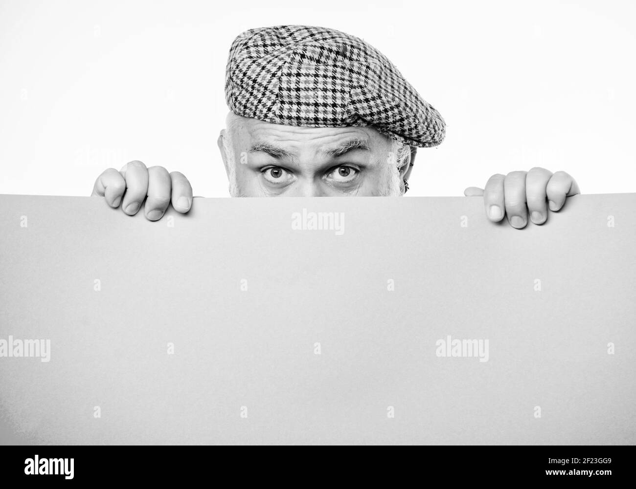 Announcement concept. Senior bearded man peek out of banner place ...