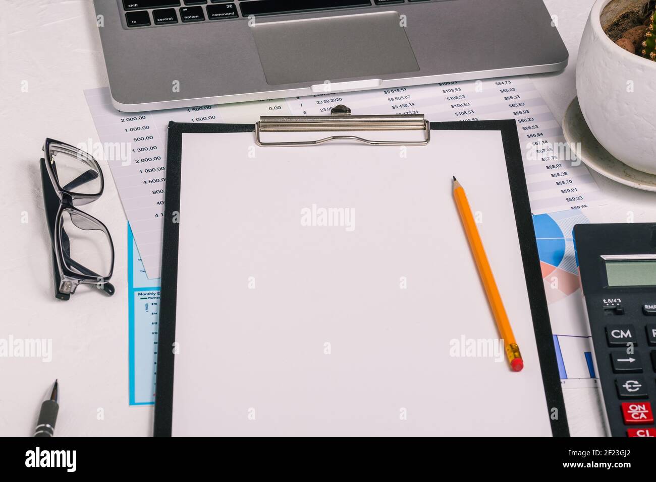 Blank sheet of paper for text on the desktop. Audit, analytics and ...