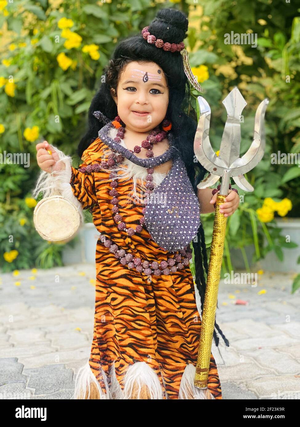 Beawar, Rajasthan, India, March 10, 2021: A child dressed as Hindu Lord ...