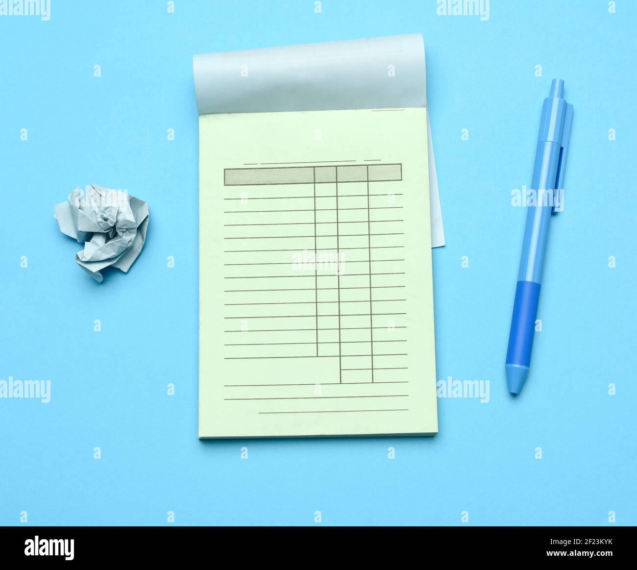 Stack of blank blue blank checks on a blue background Stock Photo - Alamy