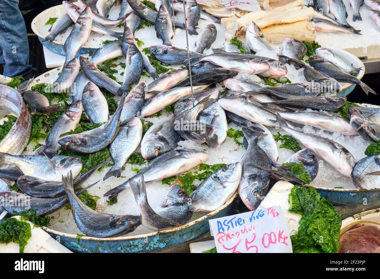 Small fish on ice for sale at a market Stock Photo - Alamy